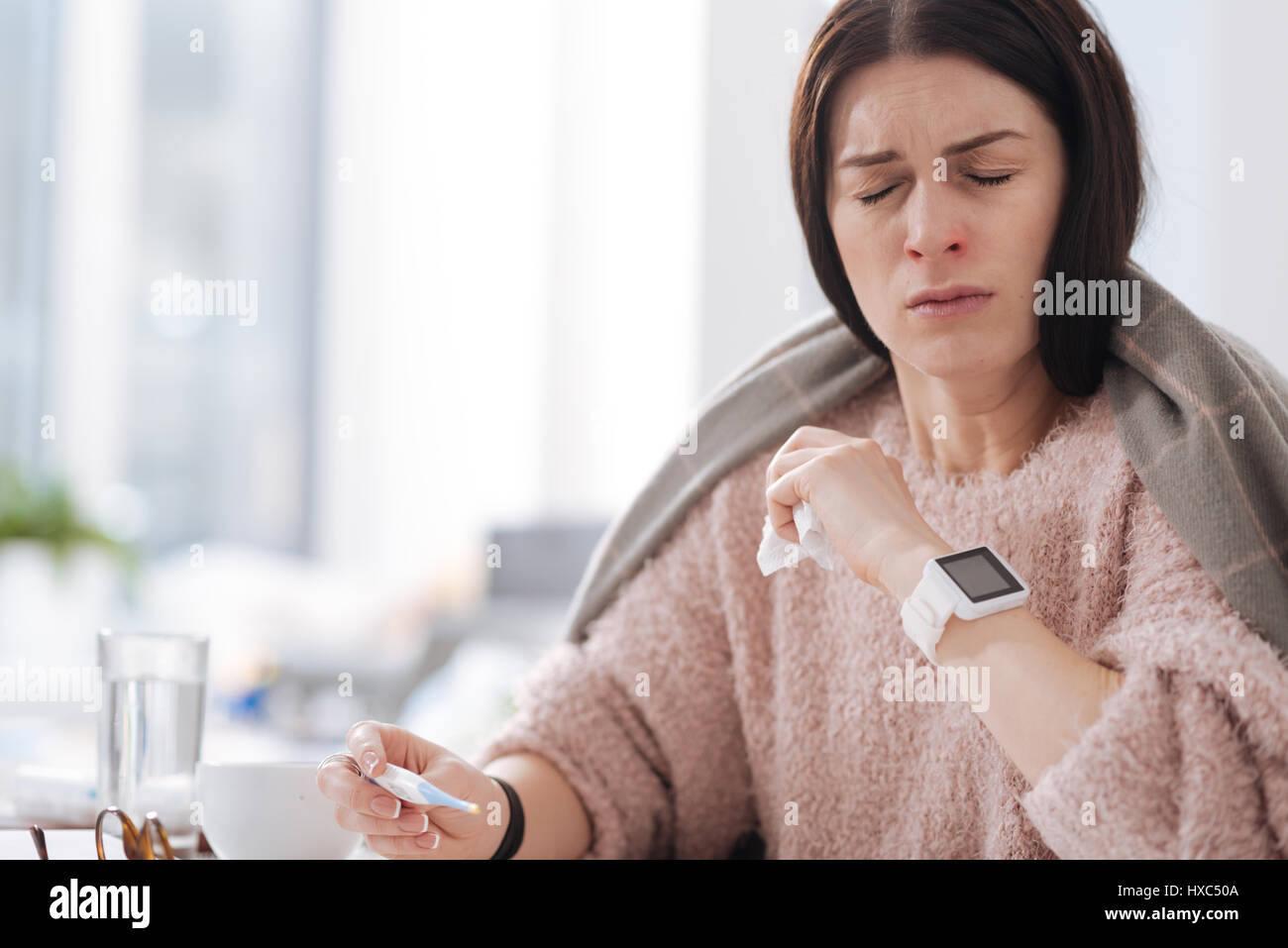 Sick person looking like sneezing Stock Photo - Alamy