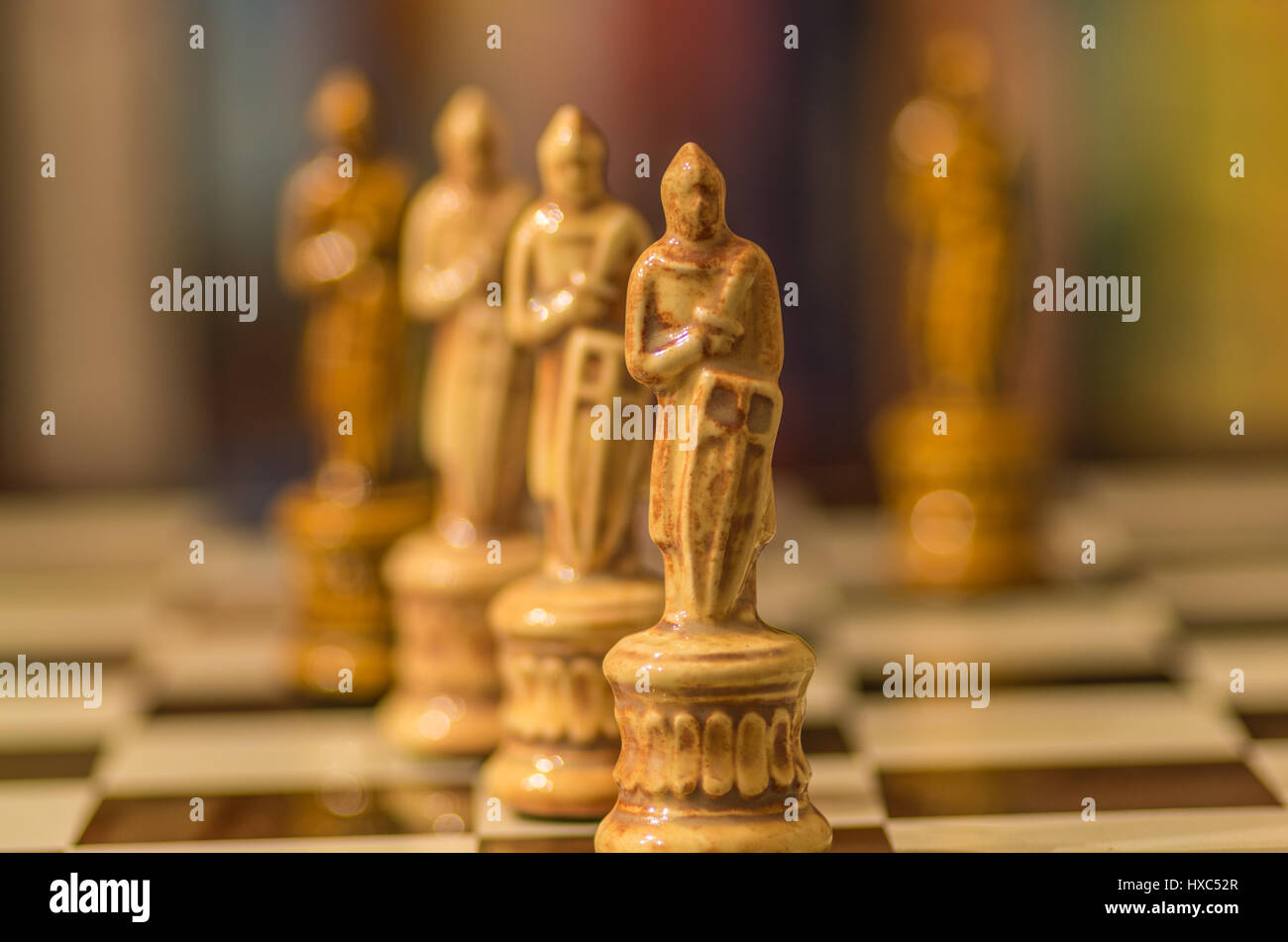 Ornate Chess pieces in focus with soft focus colourful background Stock ...