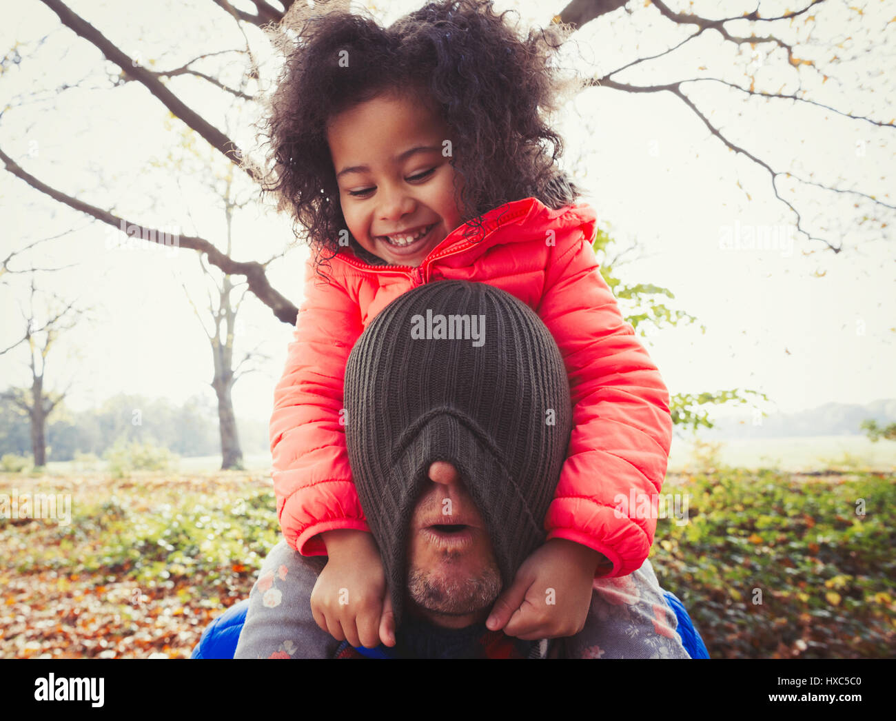 Cute girl pulling hat down hi-res stock photography and images - Alamy