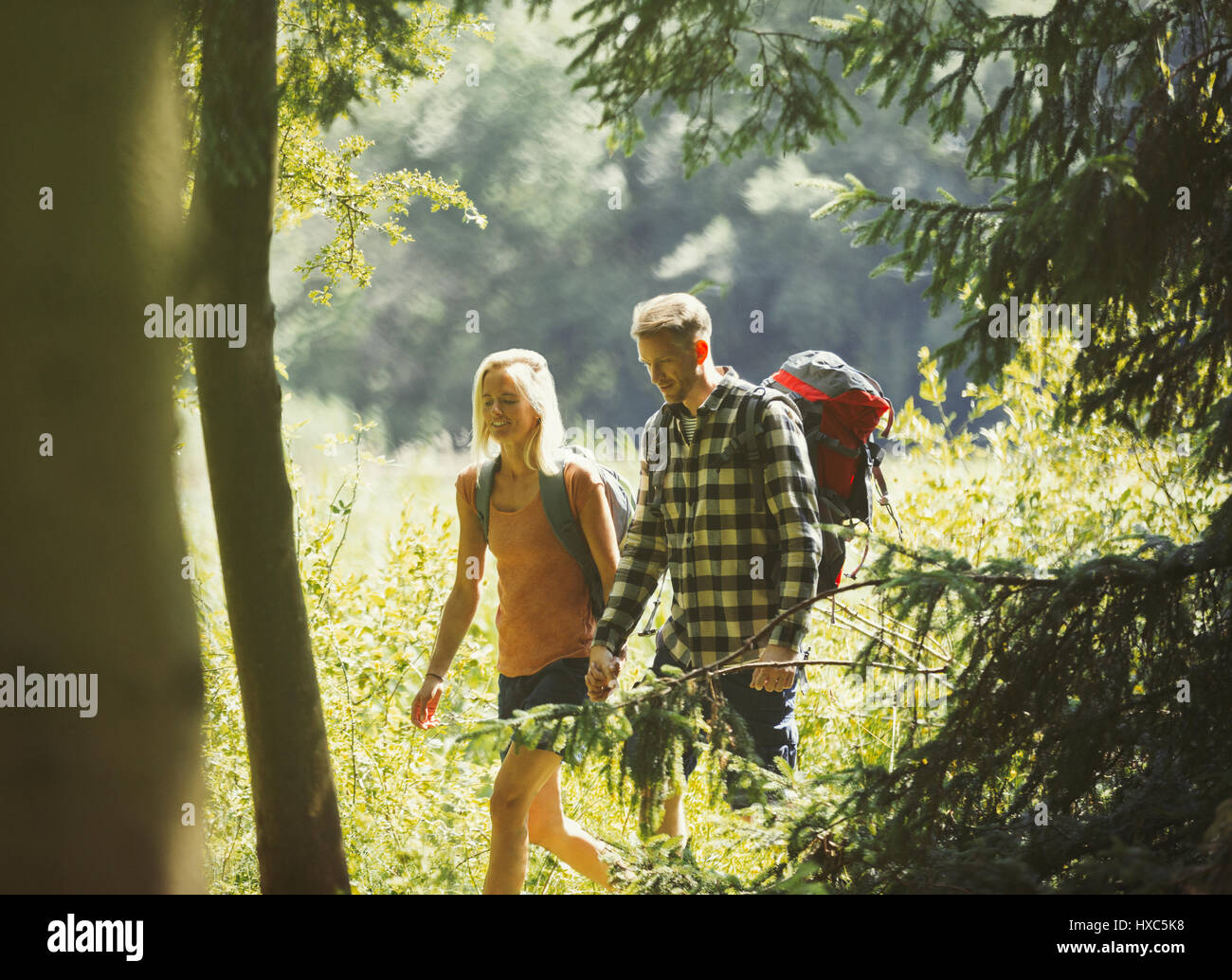 Man woman couple backpacks hi-res stock photography and images - Alamy