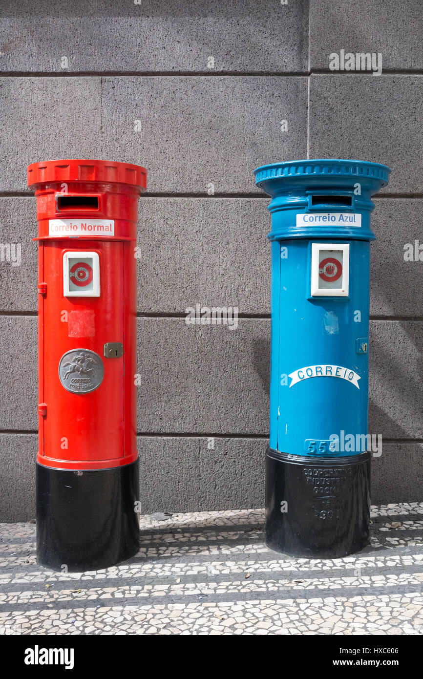 Red and blue classic shaped Portugese CTT postal boxes on the island of ...
