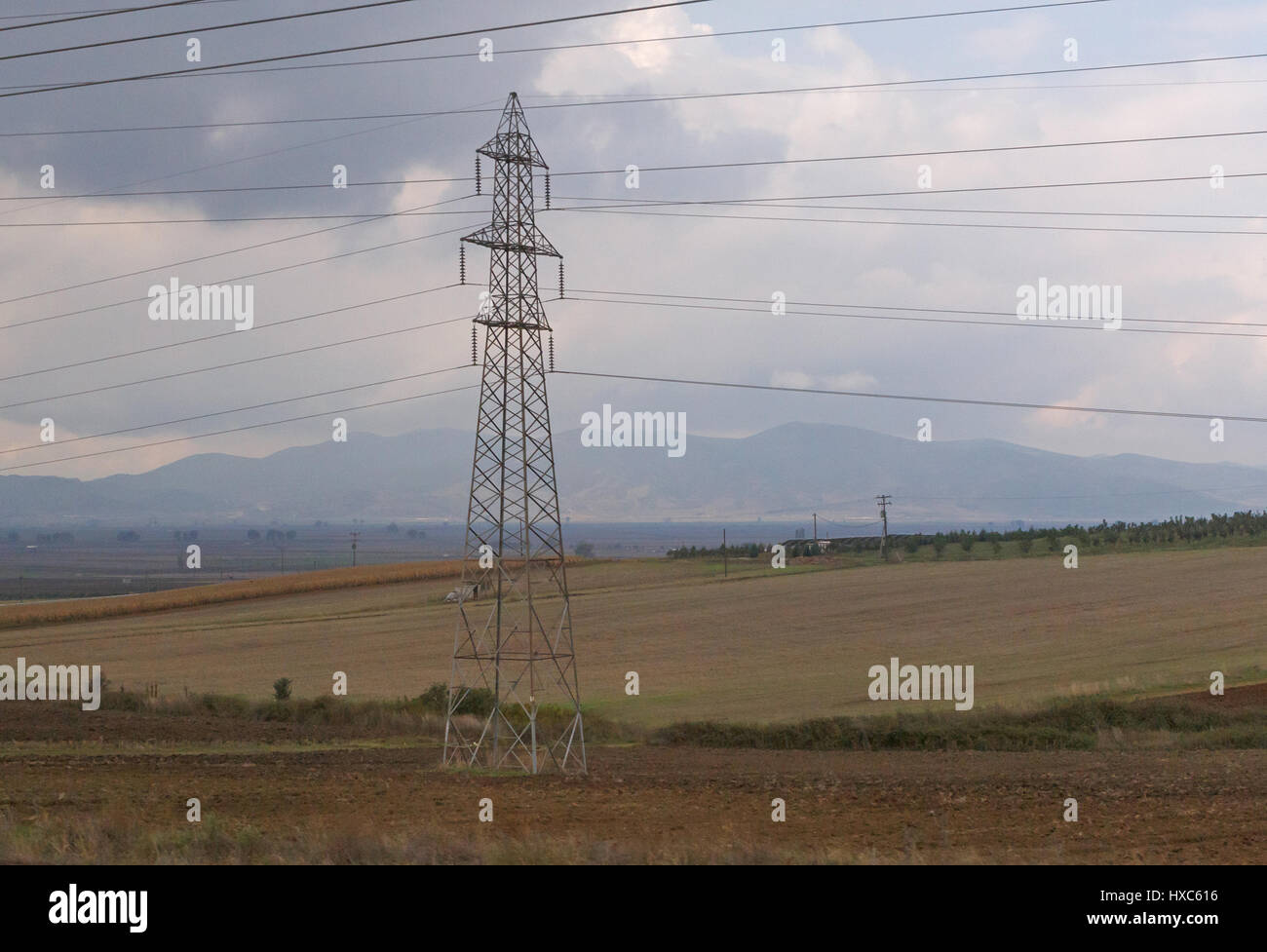 landscape with electricity pylon in Greece Stock Photo - Alamy