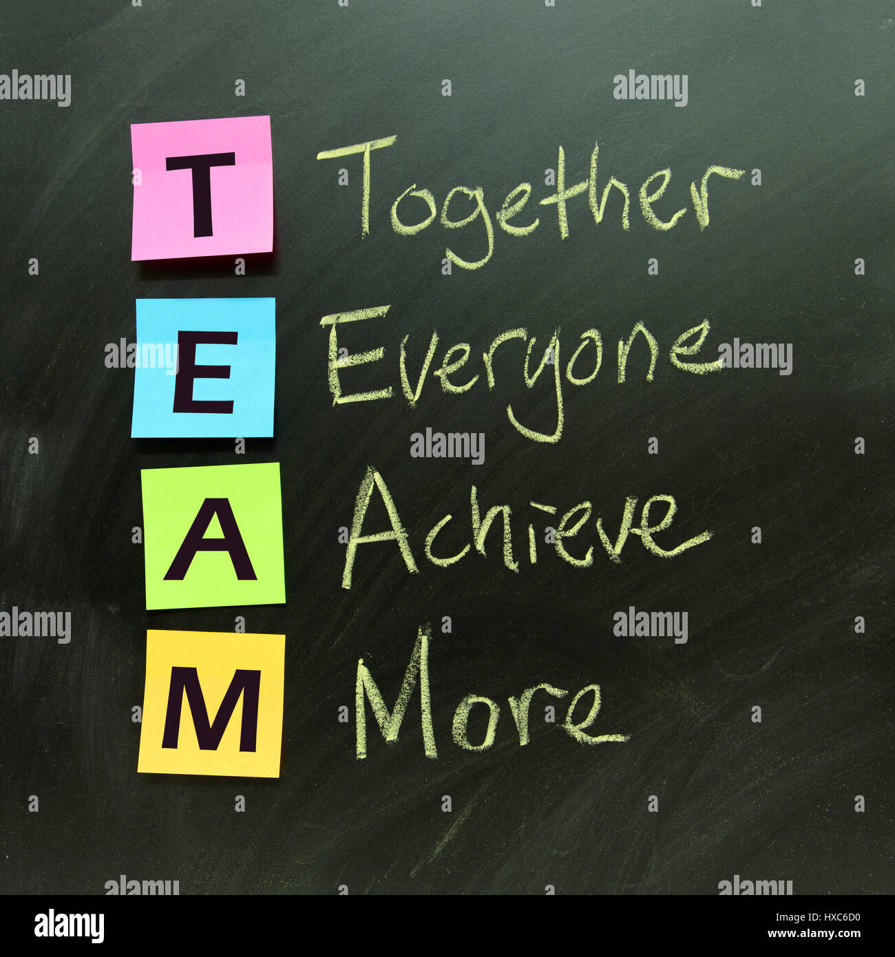 Team concept on black board indicates together everyone achieve more ...