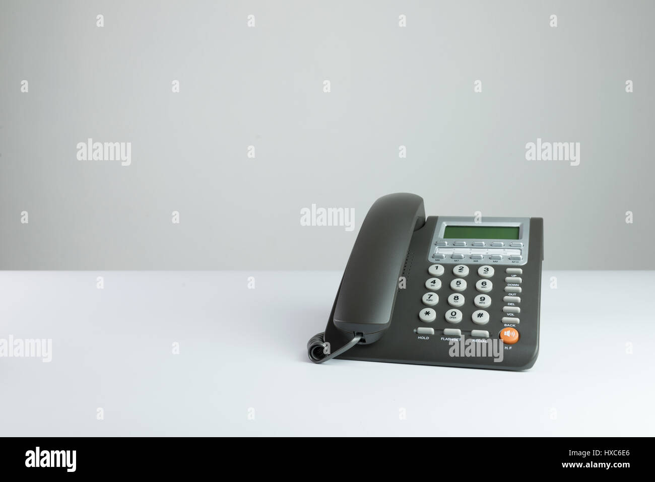 Modern grey color desk telephone isolated on white background Stock ...