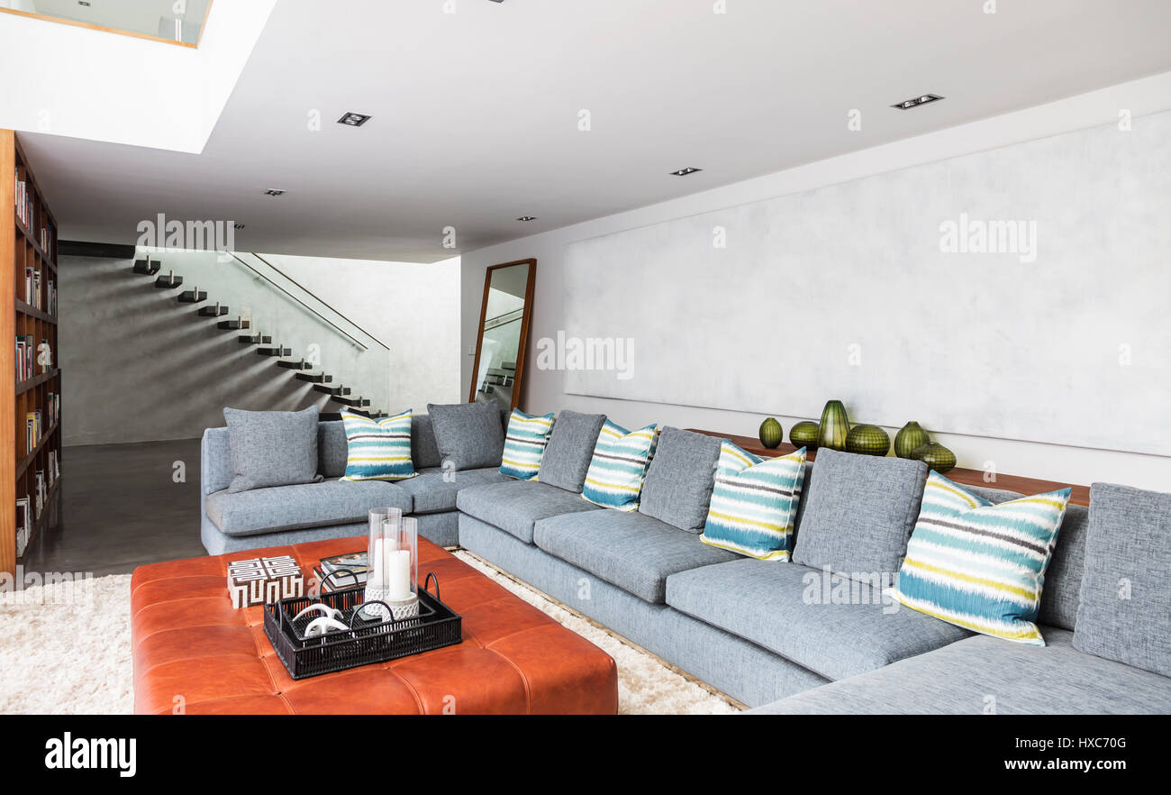 Home showcase interior living room with long sectional sofa Stock Photo ...