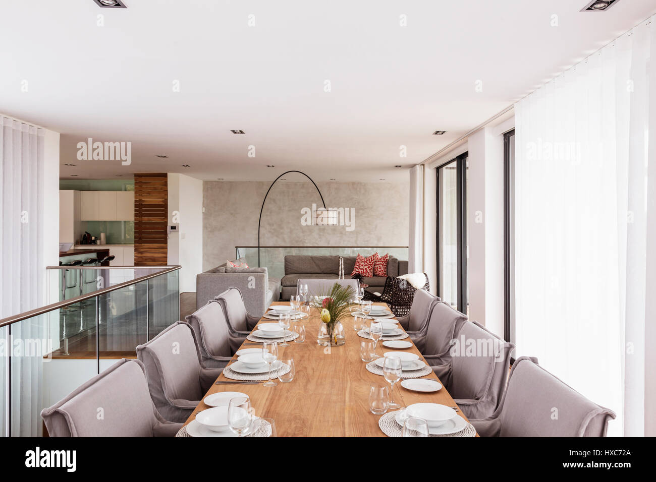 Modern, luxury home showcase interior dining room with placesettings on ...