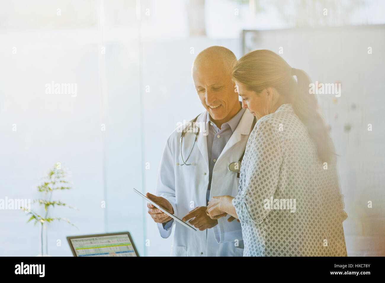 Doctor watching female patient using hi-res stock photography and ...