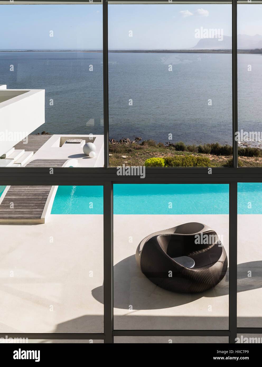 Modern luxury home showcase exterior infinity pool with sunny ocean ...