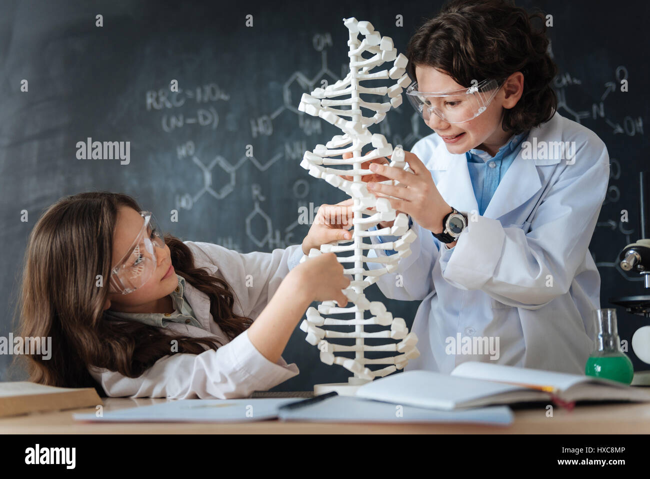 Inventive kids studying microbiology in the laboratory Stock Photo - Alamy