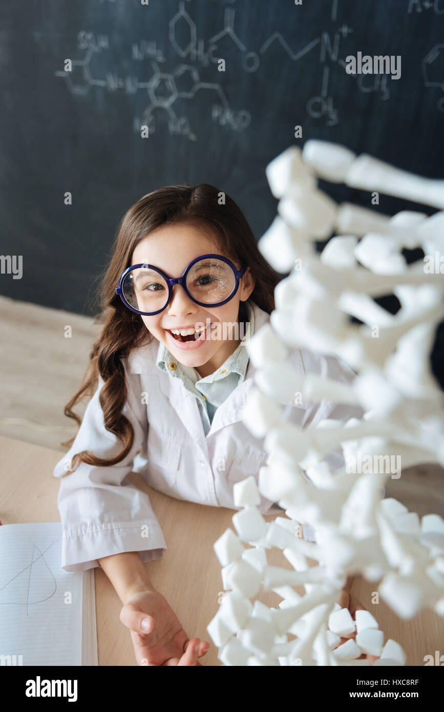 Smiling little researcher exploring DNA modifications at school Stock ...