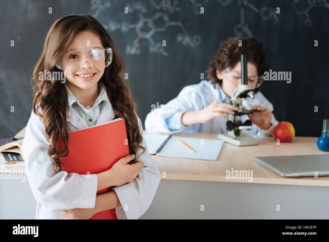 Representing our science project. Happy cheerful capable pupils ...