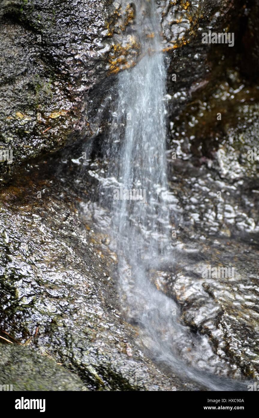 Small waterfall over the rocks Stock Photo - Alamy