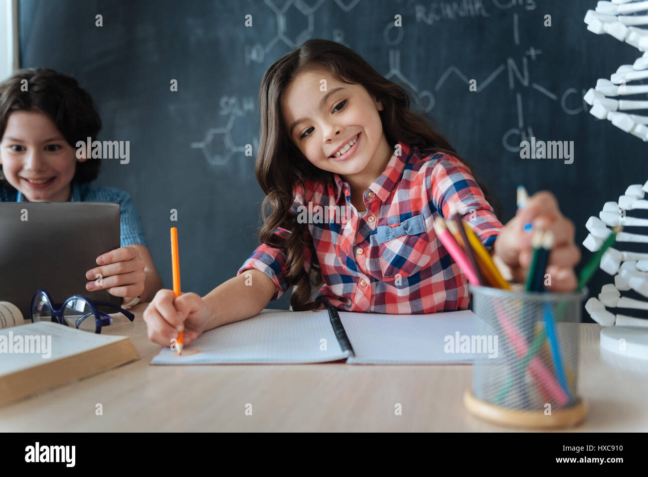 Friendly kids enjoying art class at school Stock Photo - Alamy