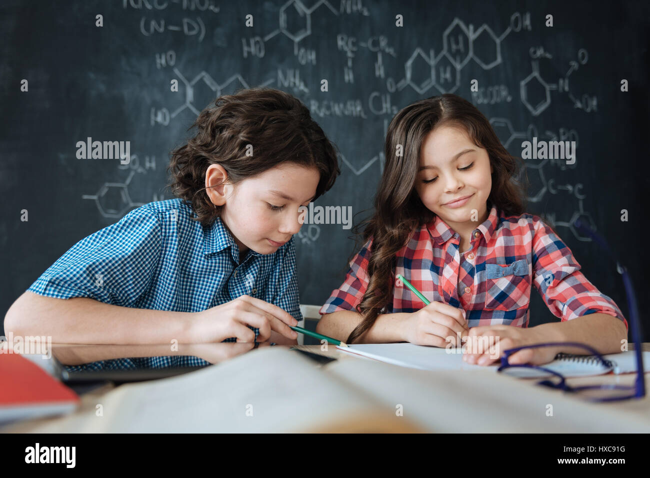 Diligent little pupils enjoying class at school Stock Photo - Alamy