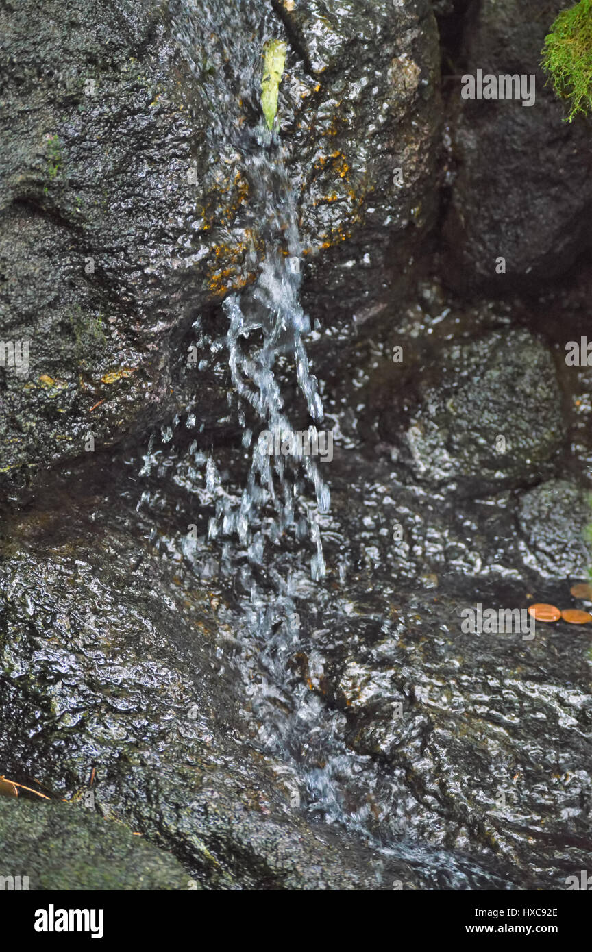 Small waterfall over the rocks Stock Photo - Alamy