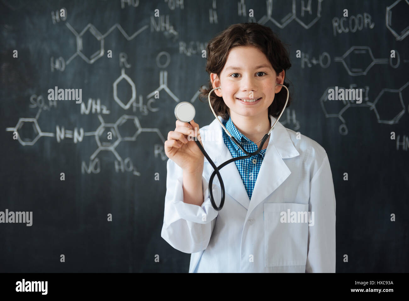 Positive teenager using stethoscope at school Stock Photo - Alamy