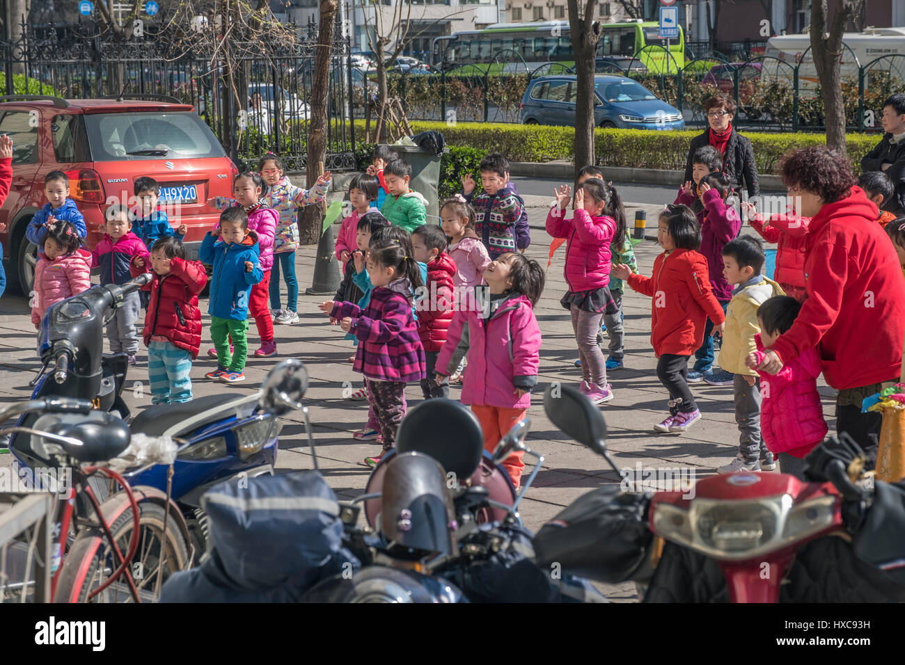 Kindergarten children learn singing and dancing outside in Beijing ...