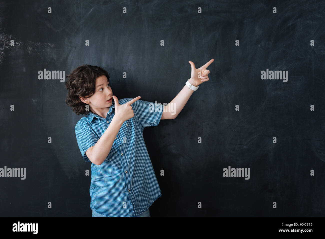 Making right choice. Helpful playful creative boy standing against ...