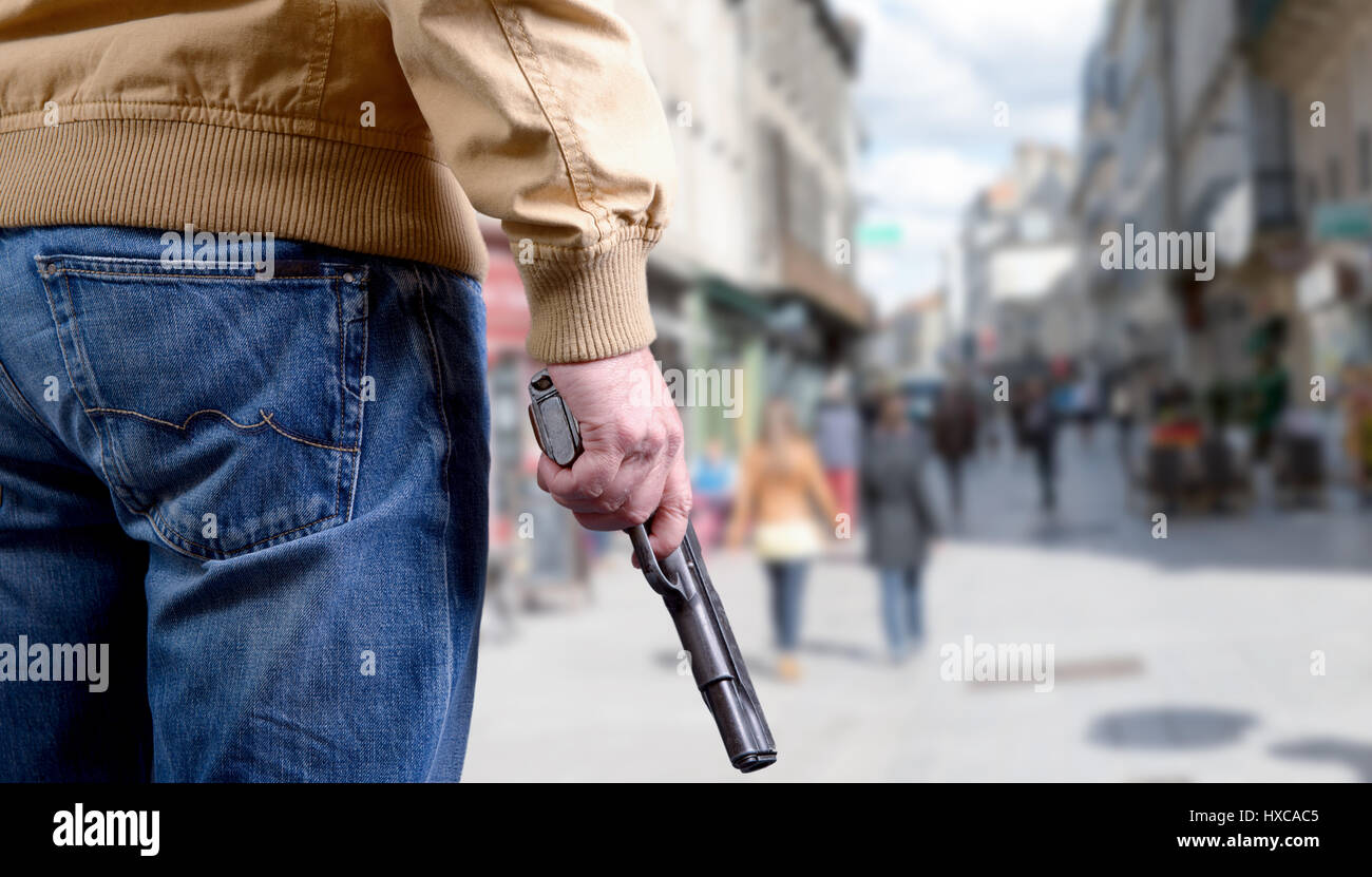 killer attacking with gun on public place Stock Photo - Alamy