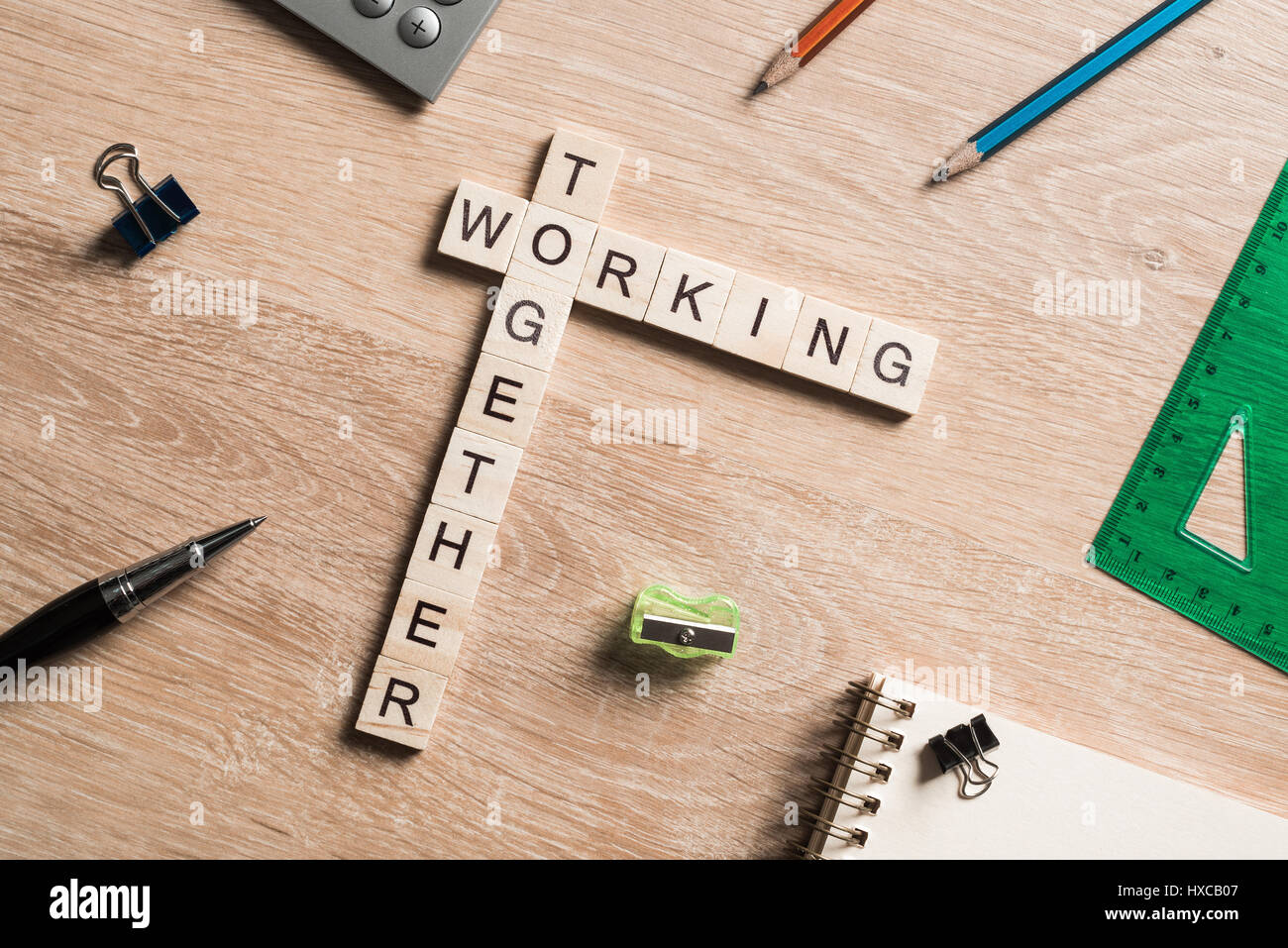 Working together words collected of game cubes on wooden surface Stock ...