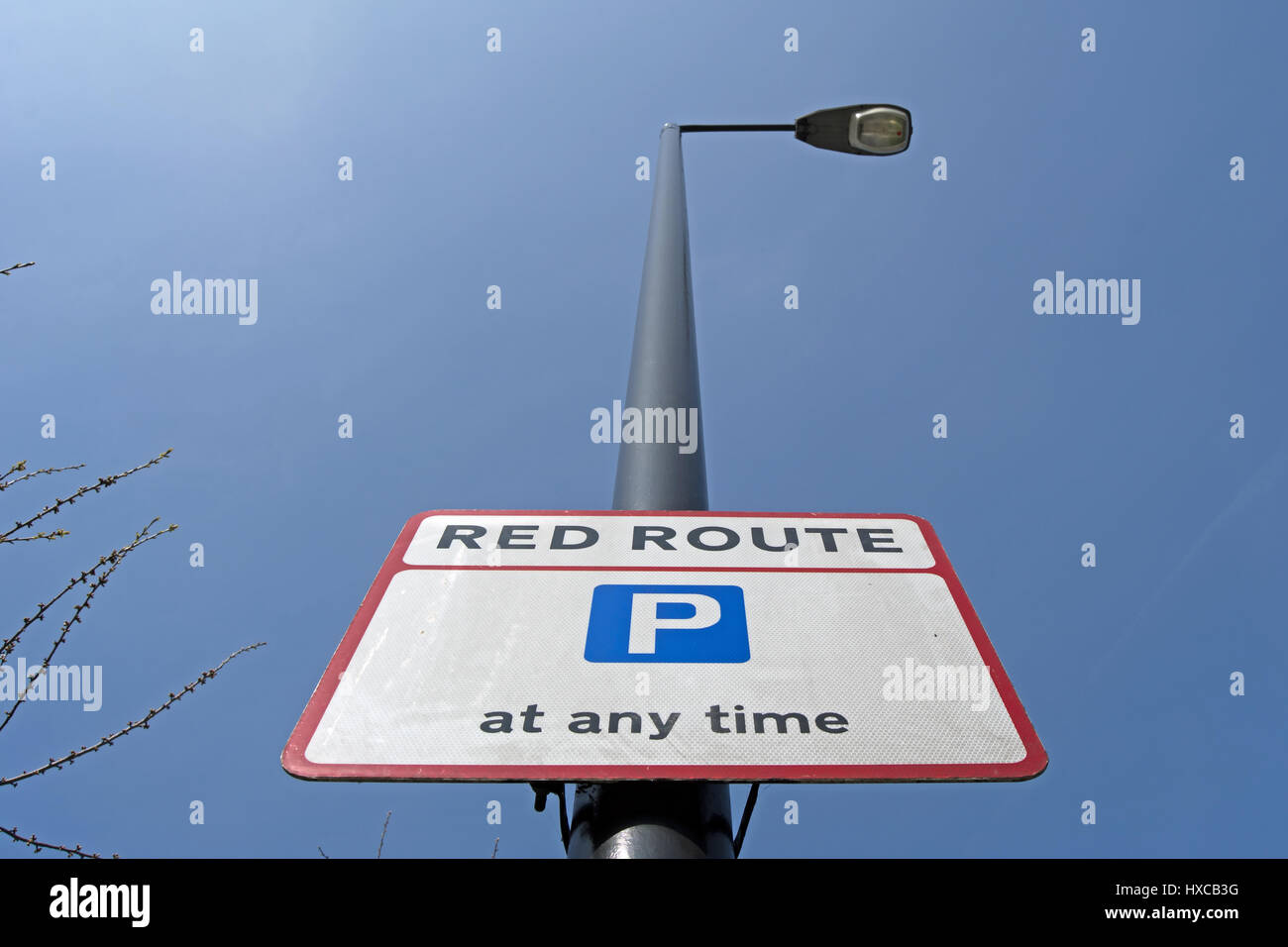 british road sign denoting a red route with parking allowed at any time ...