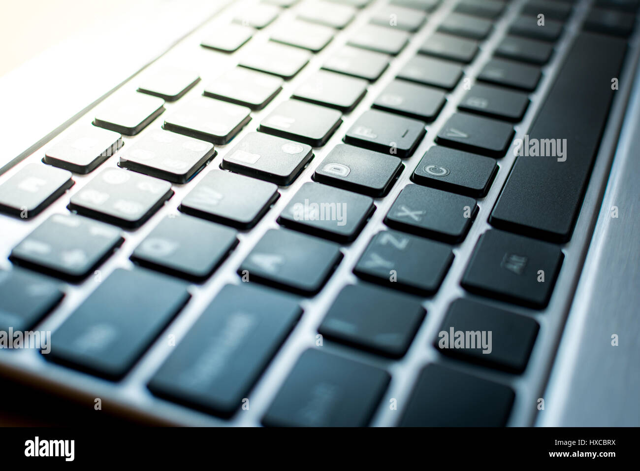 Metallic keyboard wirh black keys of computer or laptop Stock Photo - Alamy