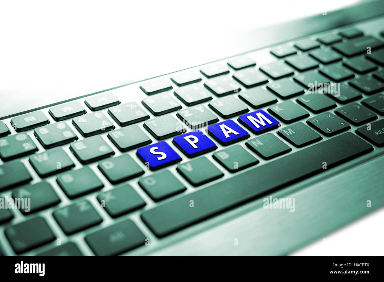 Keyboard of computer or laptop with blue sign spam Stock Photo - Alamy