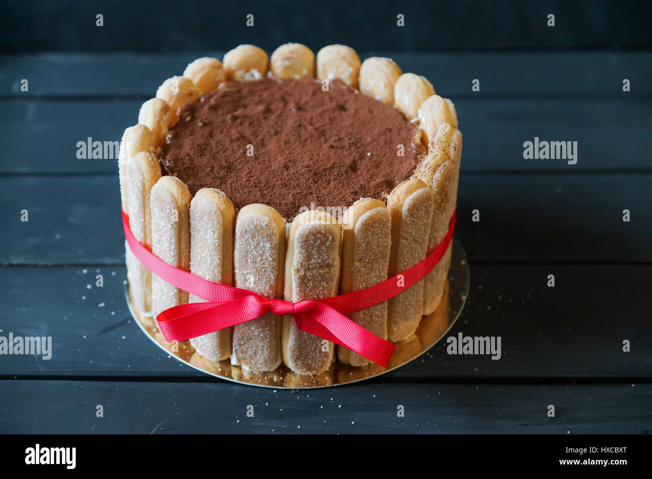 Beautiful biscuit cake with cookies around it Stock Photo - Alamy