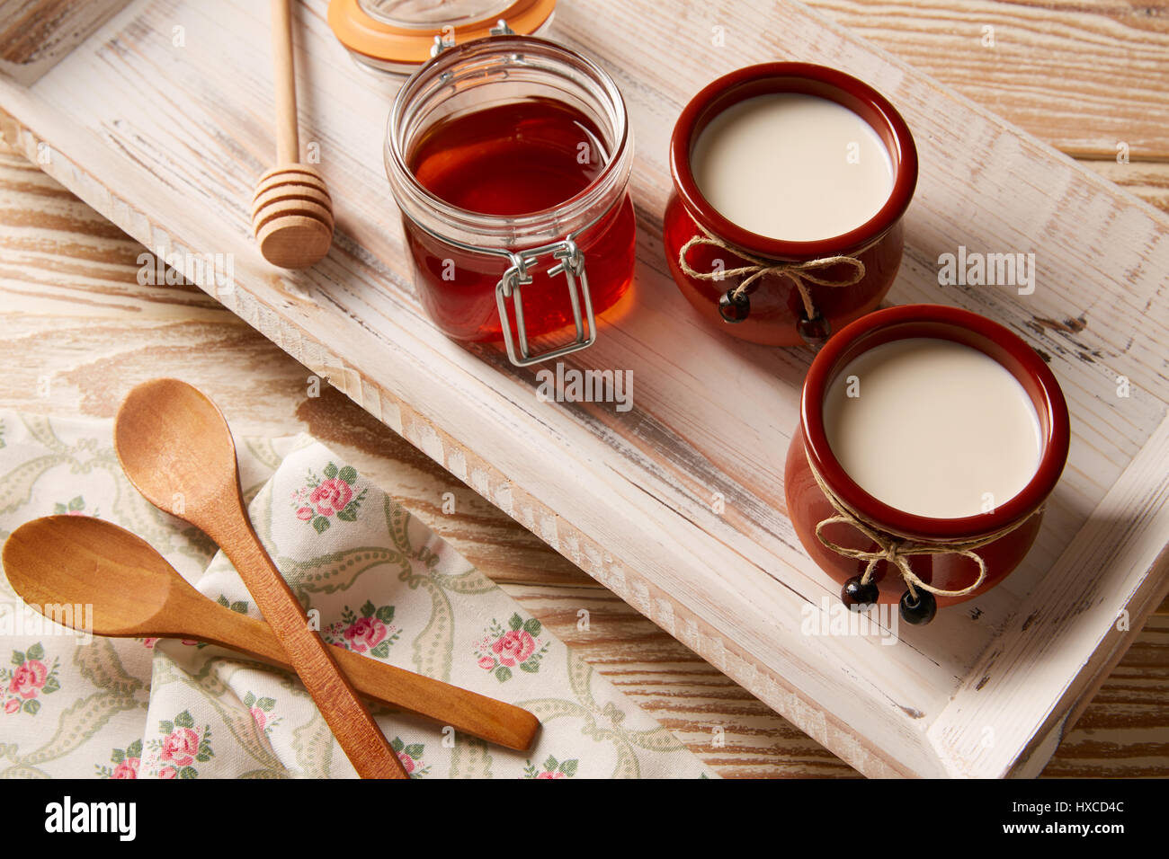 Curd dairy dessert with honey in white wooden tray Stock Photo - Alamy