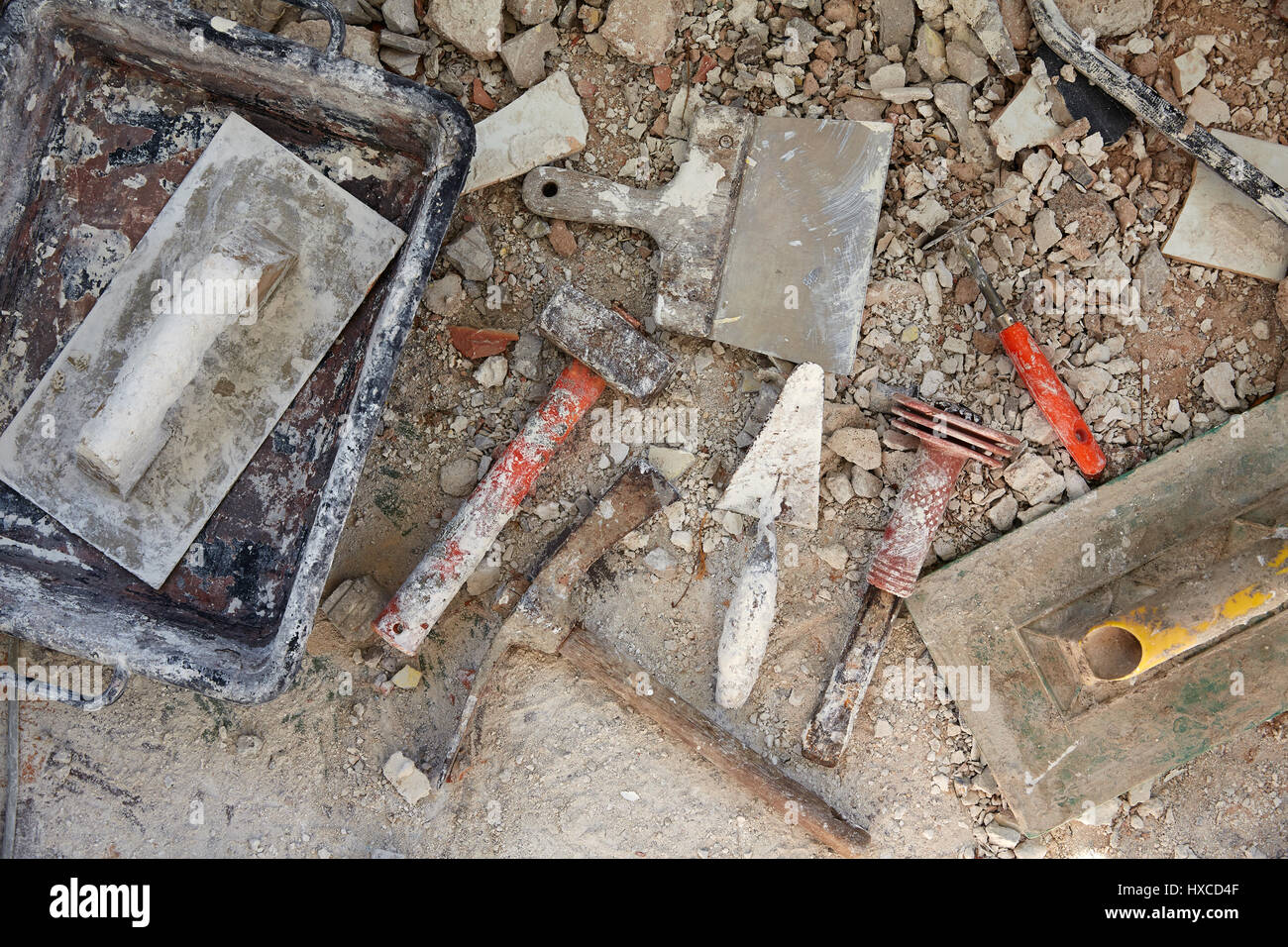 Mason tools on debris background in house improvement construction ...