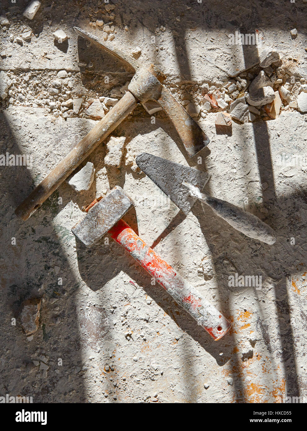 Mason tools on debris background in house improvement construction ...