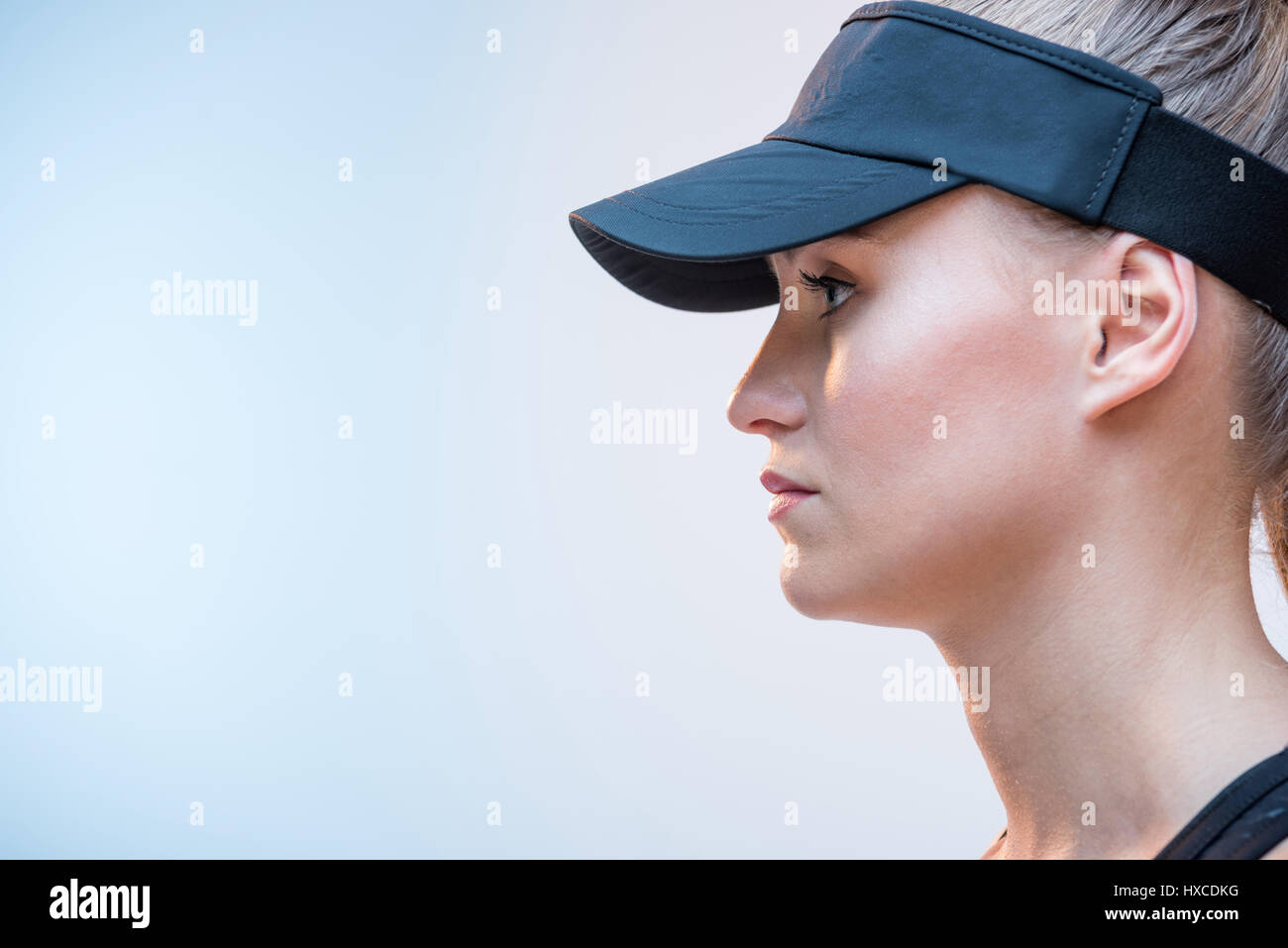 side view of beautiful thoughtful woman in black cap Stock Photo - Alamy