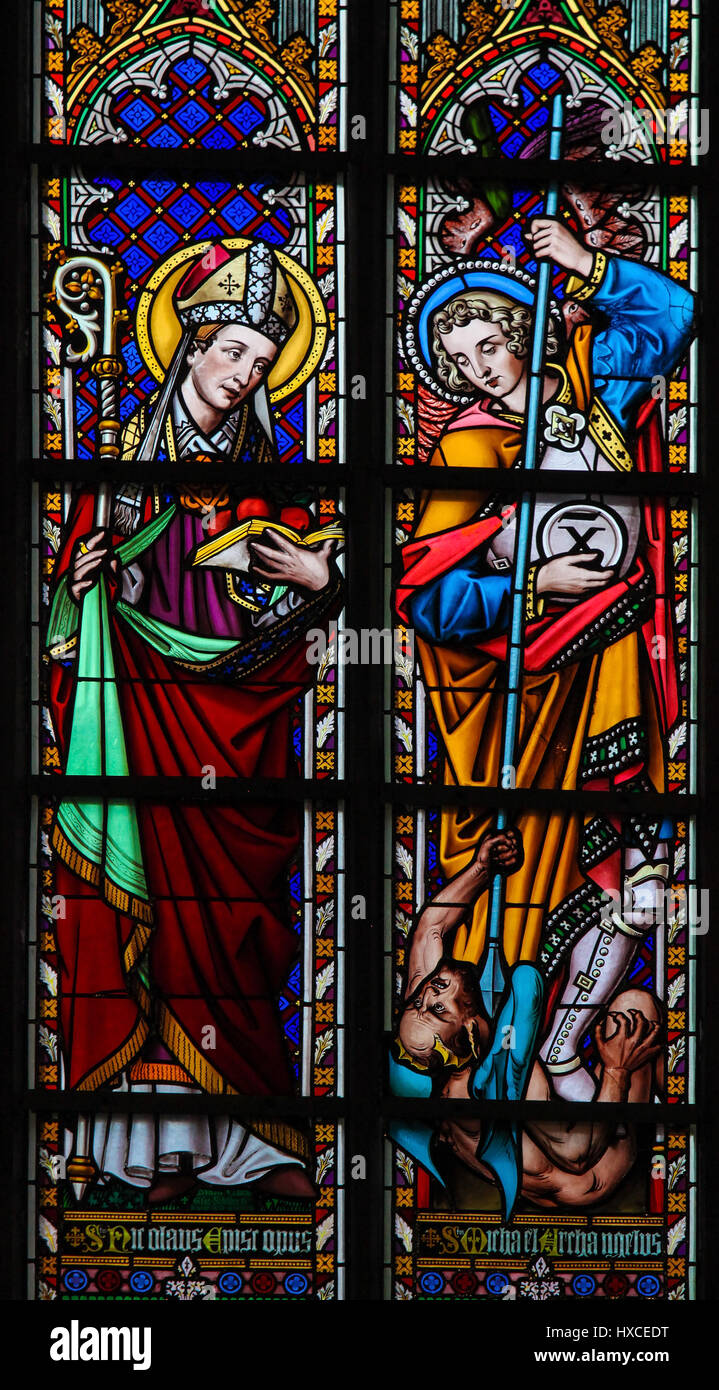 Devil stained glass window church hi-res stock photography and images ...