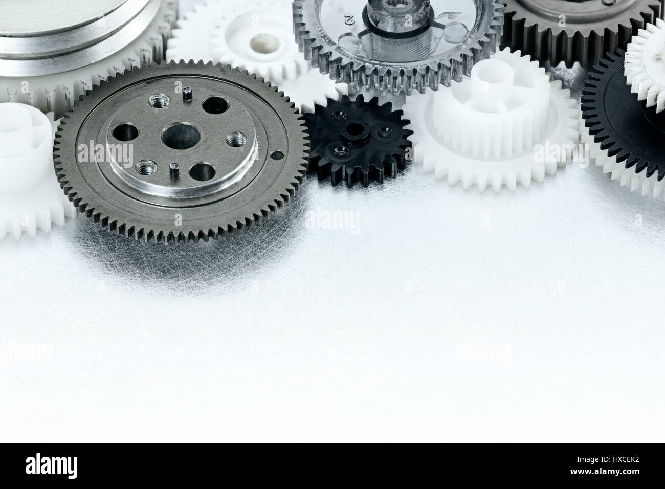 plastic gear cogwheels for industry on scratched metal background Stock Photo - Alamy