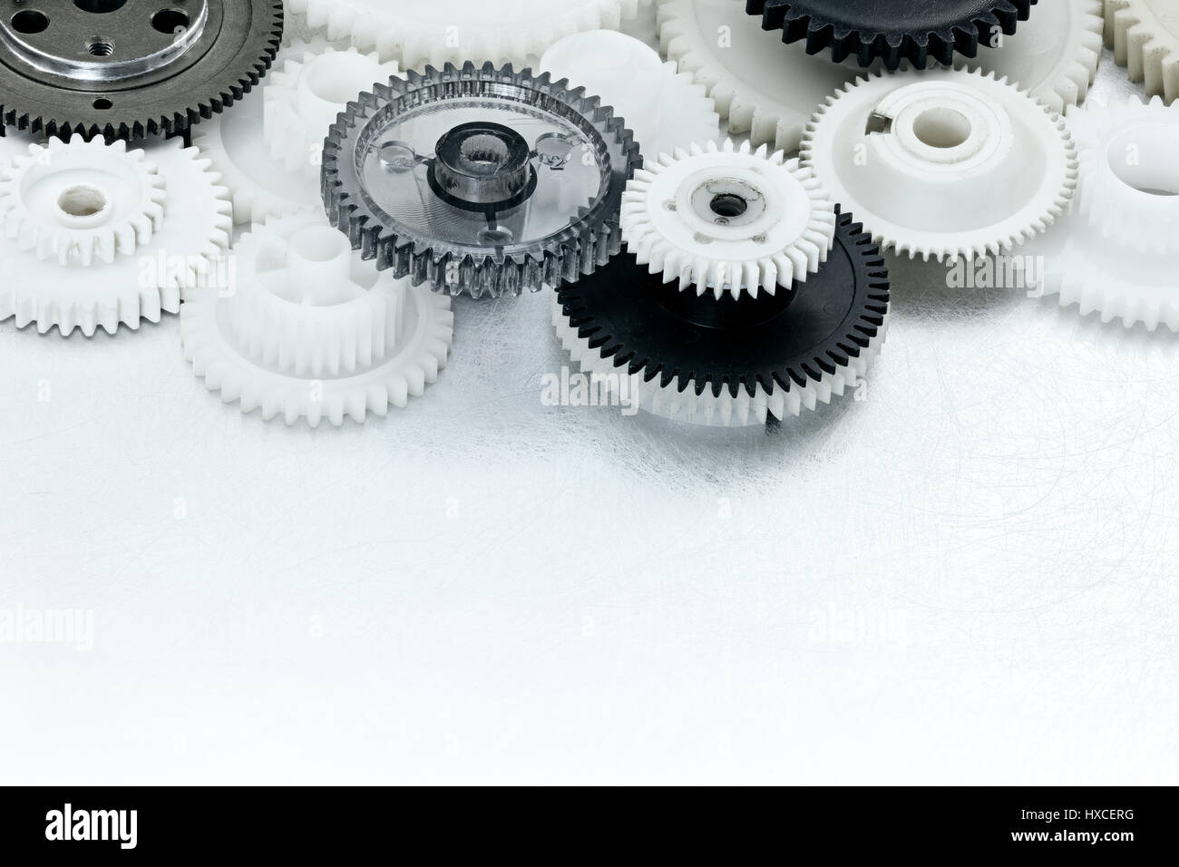 different colors plastic gear cogwheels on scratched industrial ...