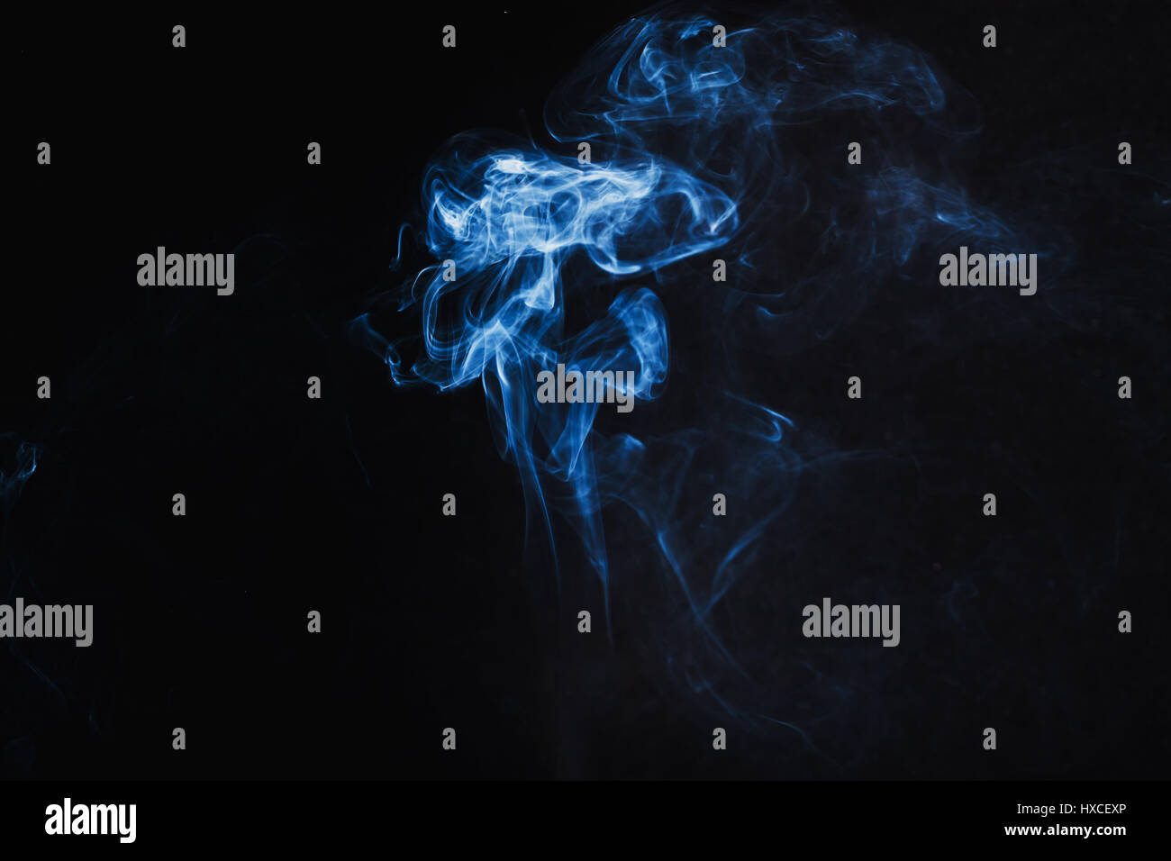 Abstract Blue Smoke on black background Stock Photo - Alamy
