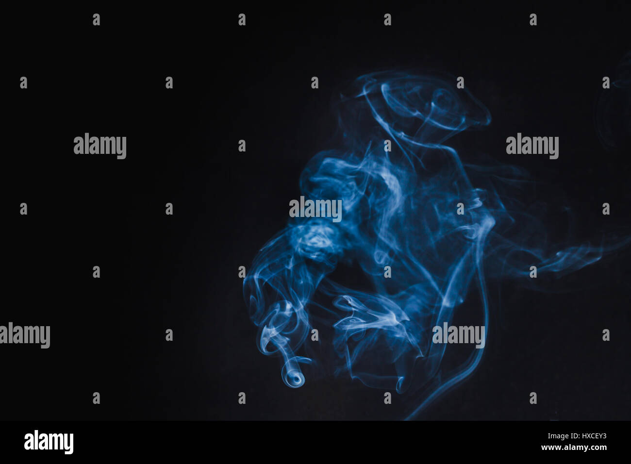 Abstract Blue Smoke on black background Stock Photo - Alamy