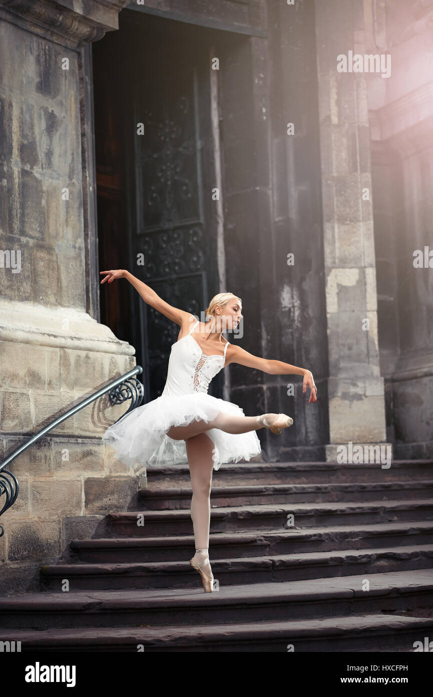 Beautiful ballet woman on stairs Stock Photo - Alamy