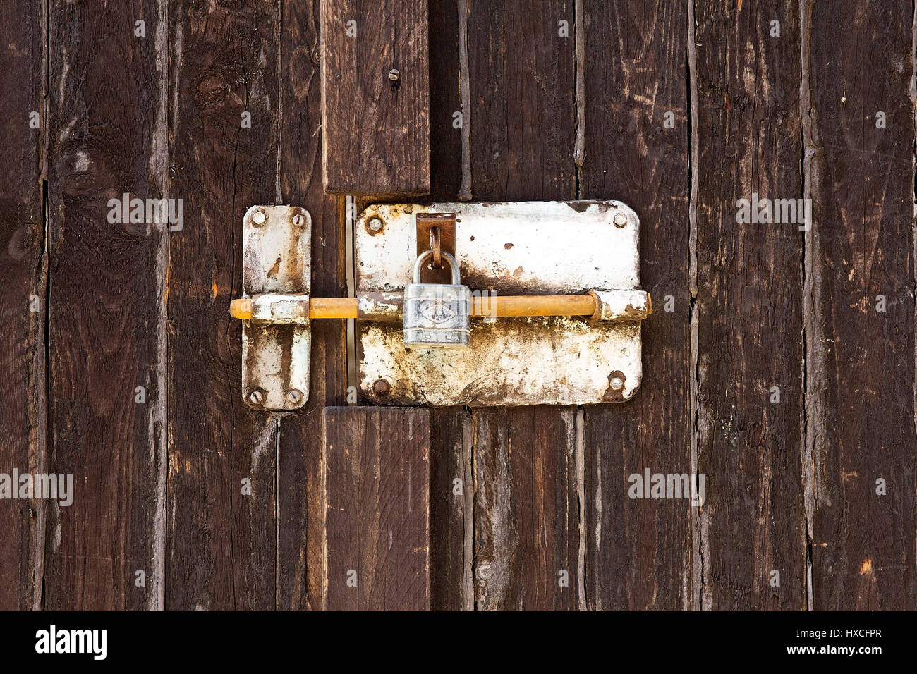 Verriegelung with padlock in a wooden gate, Locking with a padlock on a ...