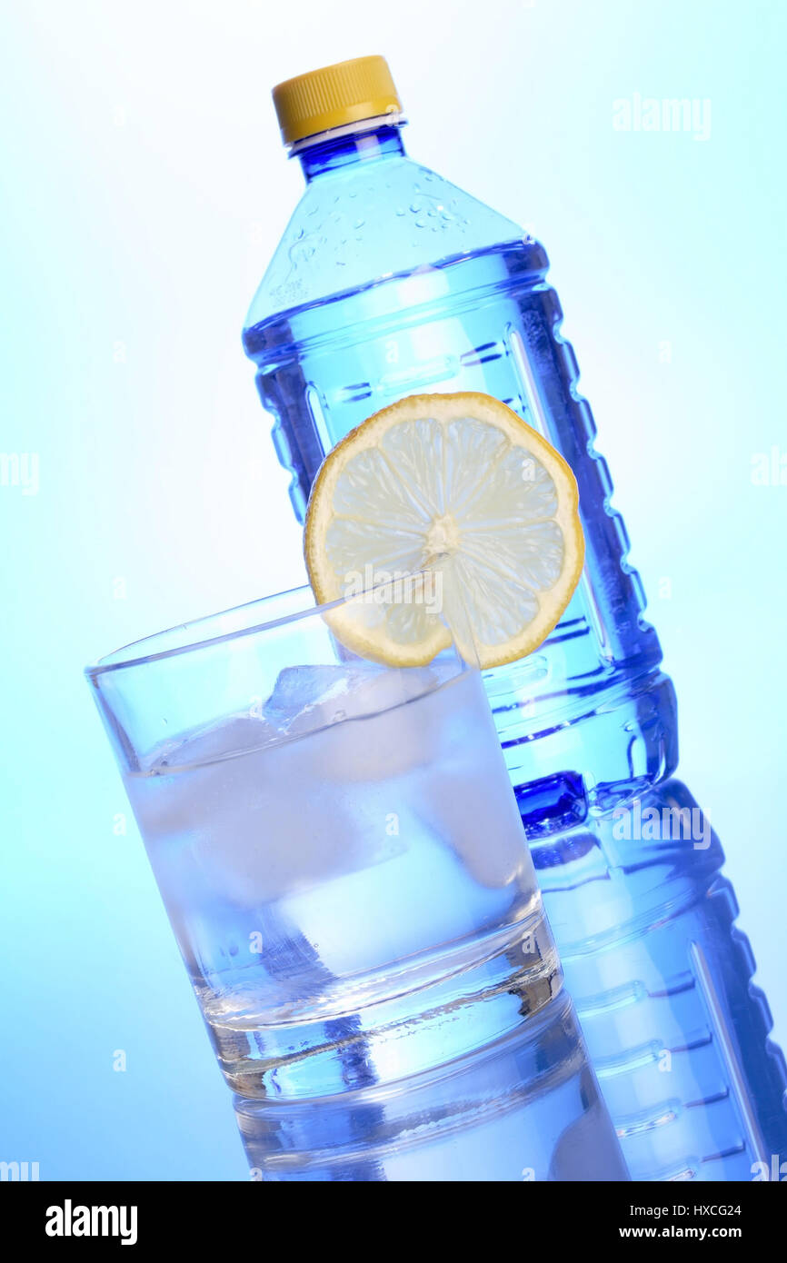 Water glass with lemon and water bottle, Wasserglas mit Zitrone und ...