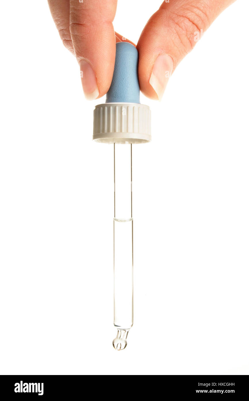 Hand with a pipette, Hand mit einer Pipette Stock Photo - Alamy