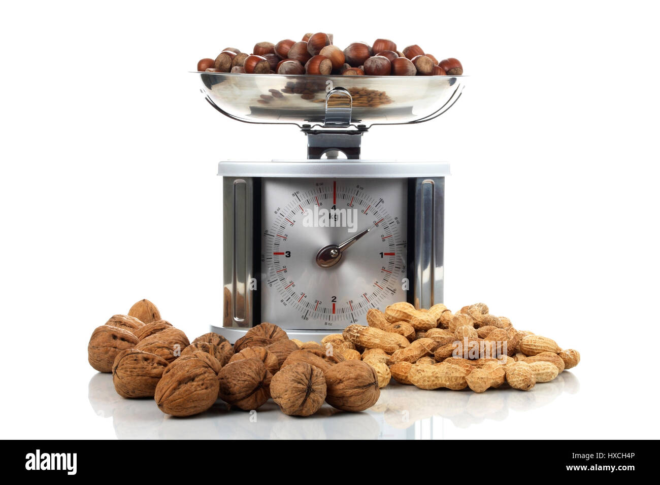 Nuts with scales, Nuesse mit Waage Stock Photo - Alamy