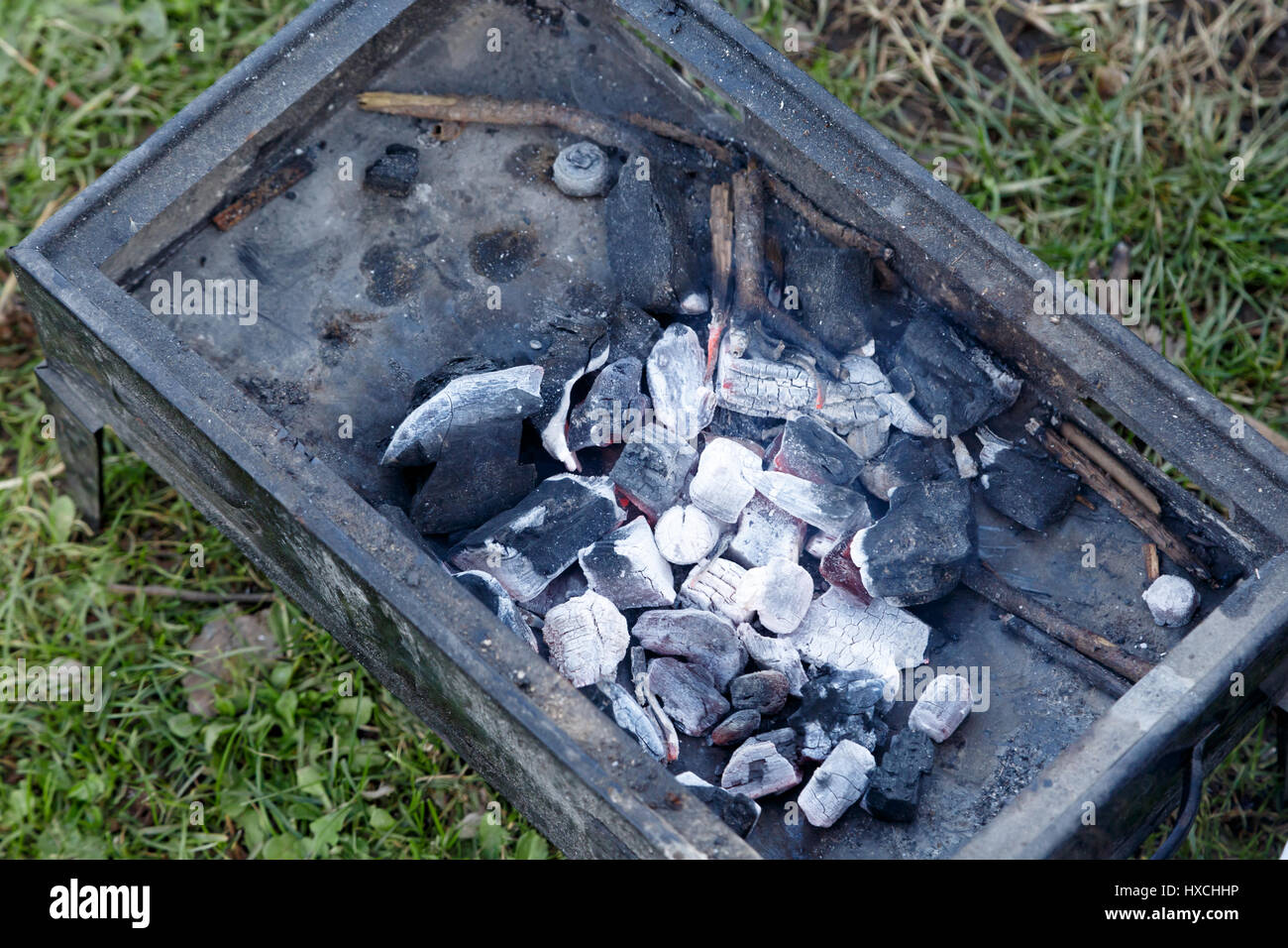 Barbecue and coal at backyard in season Stock Photo - Alamy