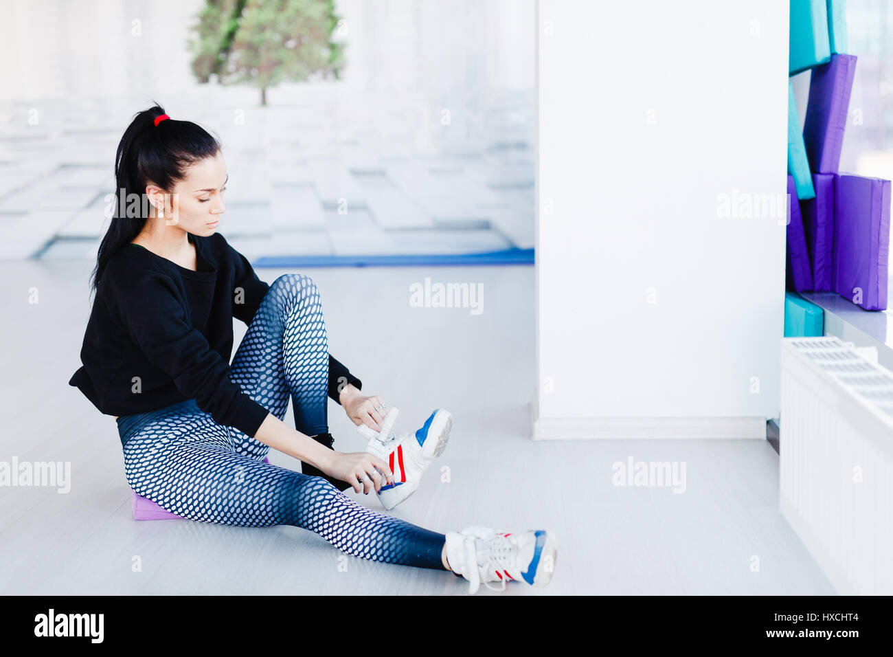 Young women doing stretching exercises on yhe bars in the aerobics ...