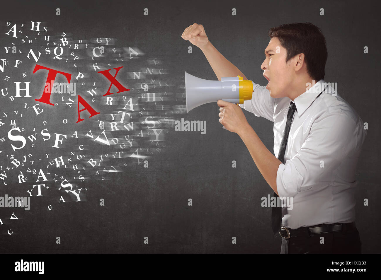 Young asian businessman using megaphone shouting notice TAX against ...