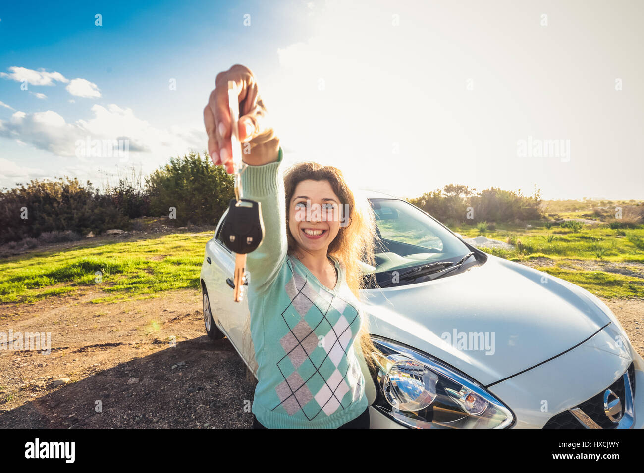 happy woman driver hold car keys near her new car Stock Photo - Alamy