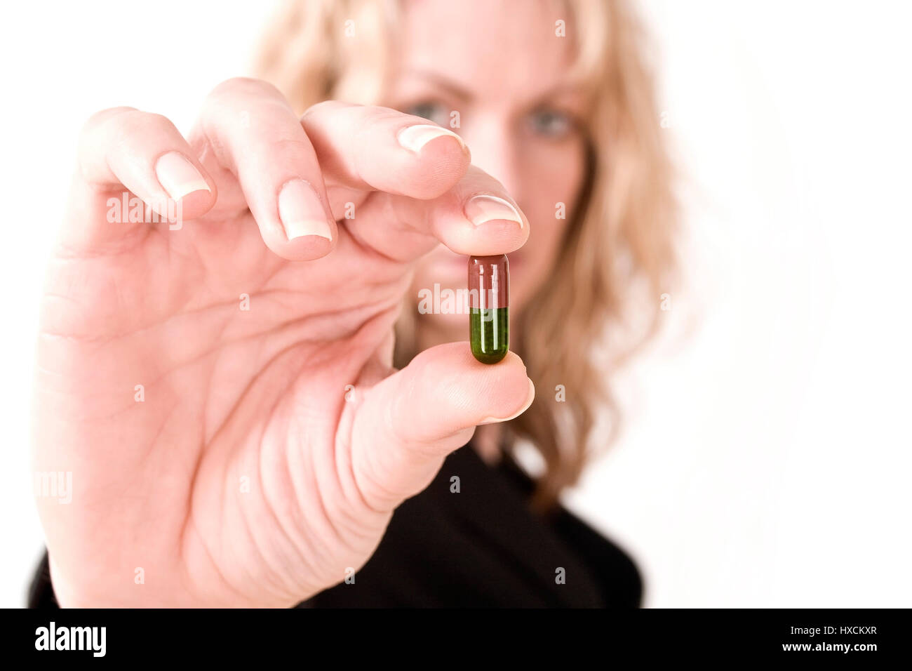 Finger holds pill hi-res stock photography and images - Alamy