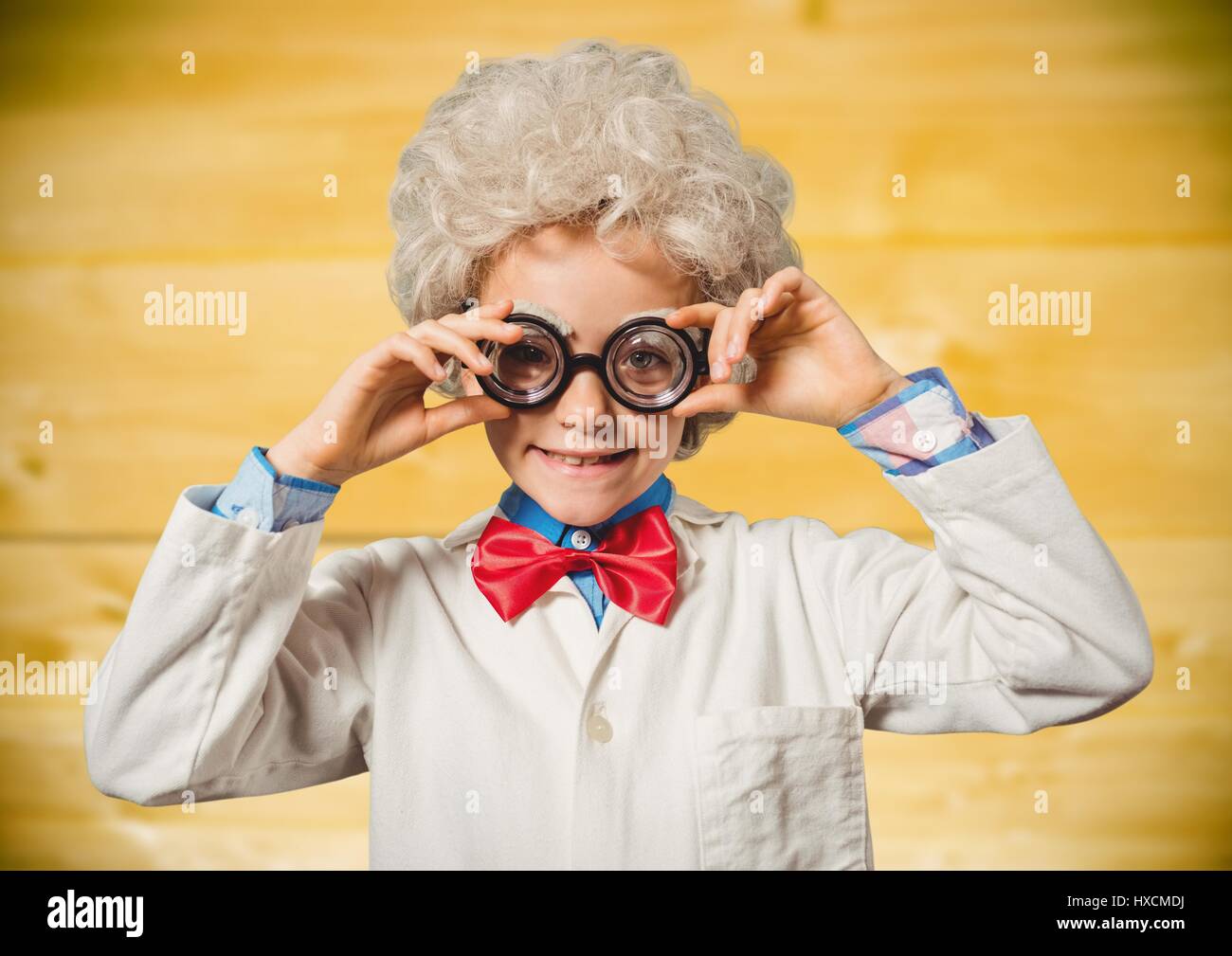Digital composite of Boy genius against yellow wood panel Stock Photo ...