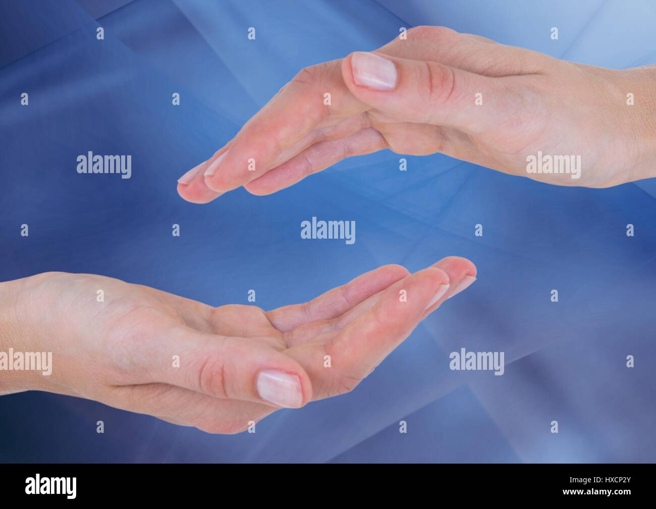 Digital composite of Hands reaching together against abstract ...