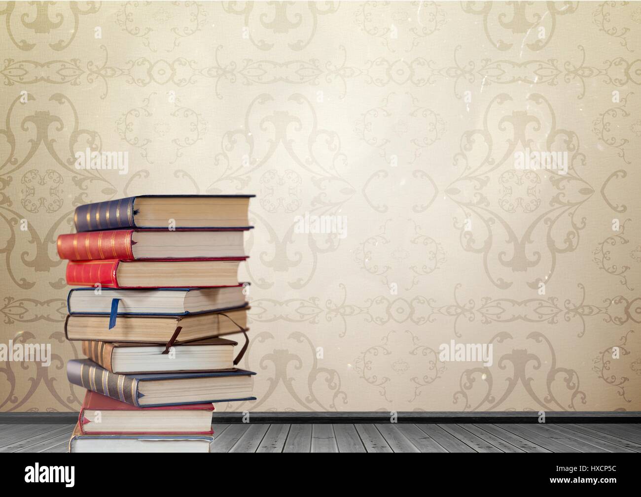 Digital composite of Books stacked by decorative wallpaper antique ...